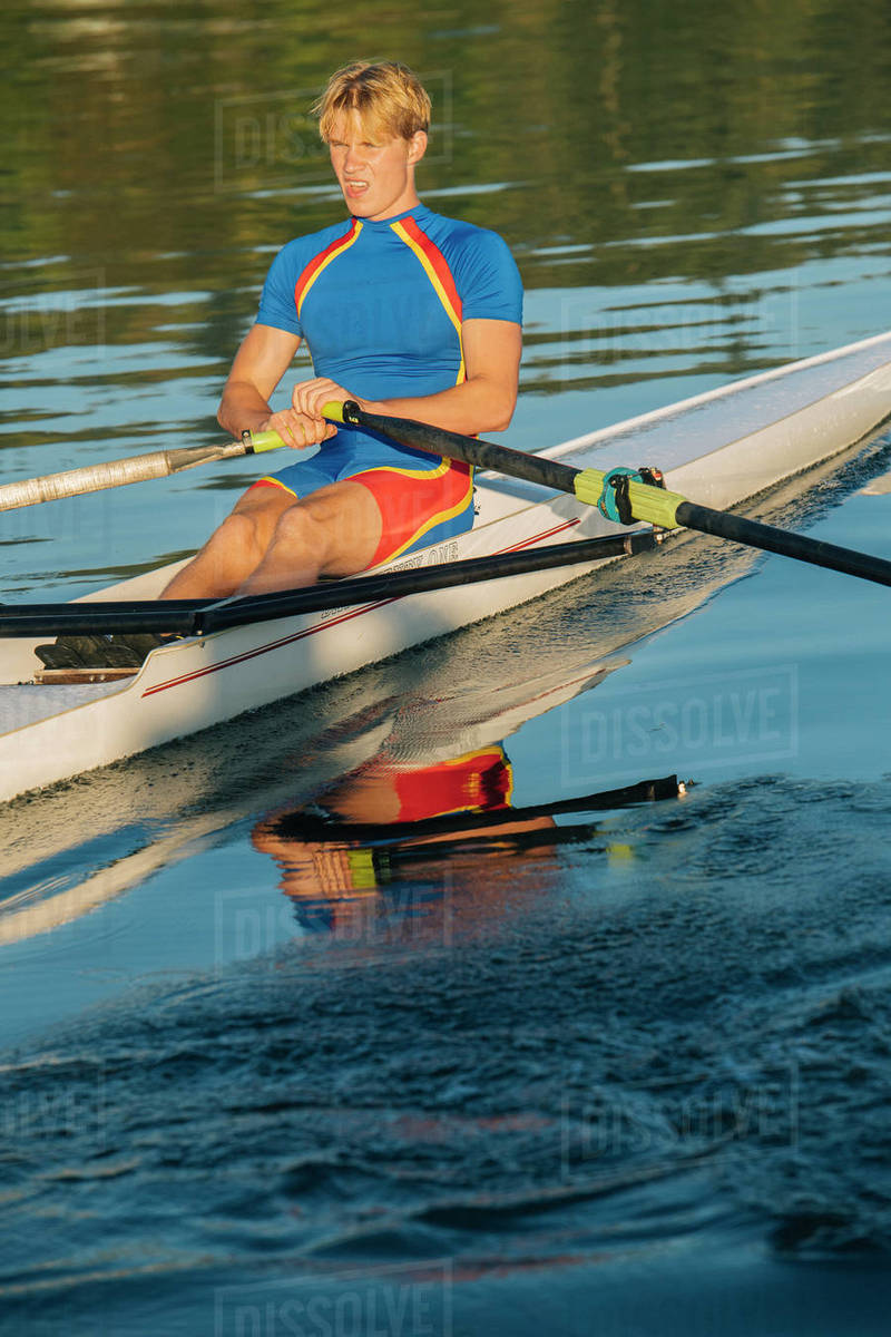 Caucasian man rowing on river - Royalty-free Stock Photo | Dissolve
