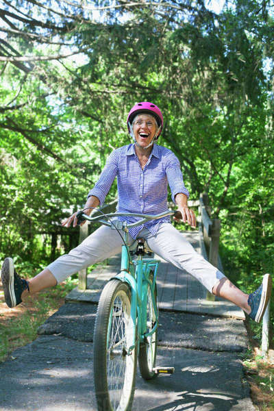 Caucasian woman sitting on bicycle with legs apart - Royalty-free Stock ...