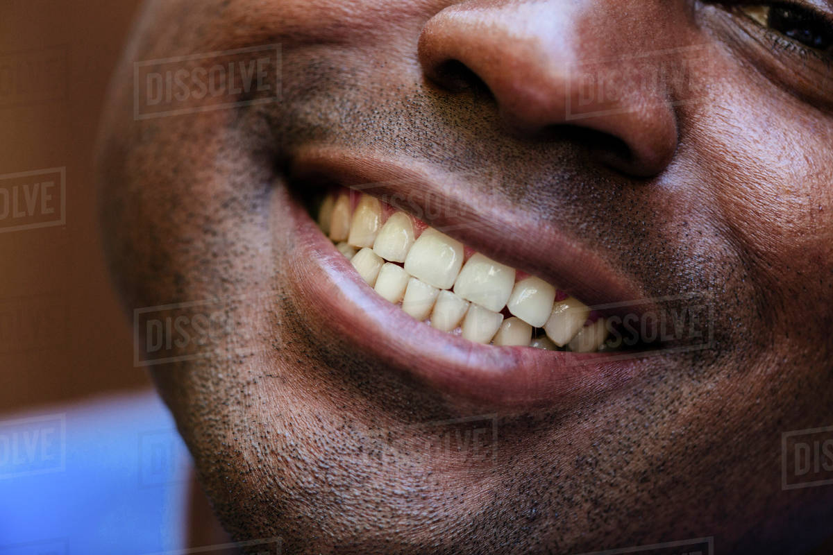 Close up of Black man smiling - Royalty-free Stock Photo | Dissolve