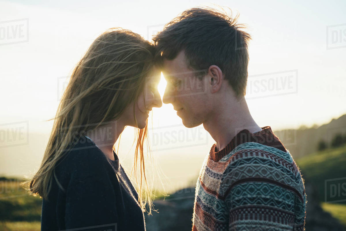 Caucasian couple face to face in landscape - Royalty-free Stock Photo ...