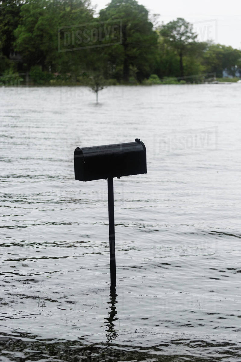 Flooding around mailbox - Stock Photo - Dissolve
