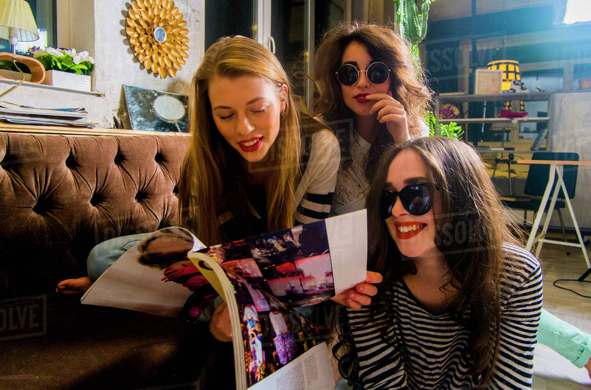 Women reading magazine - Royalty-free Stock Photo | Dissolve