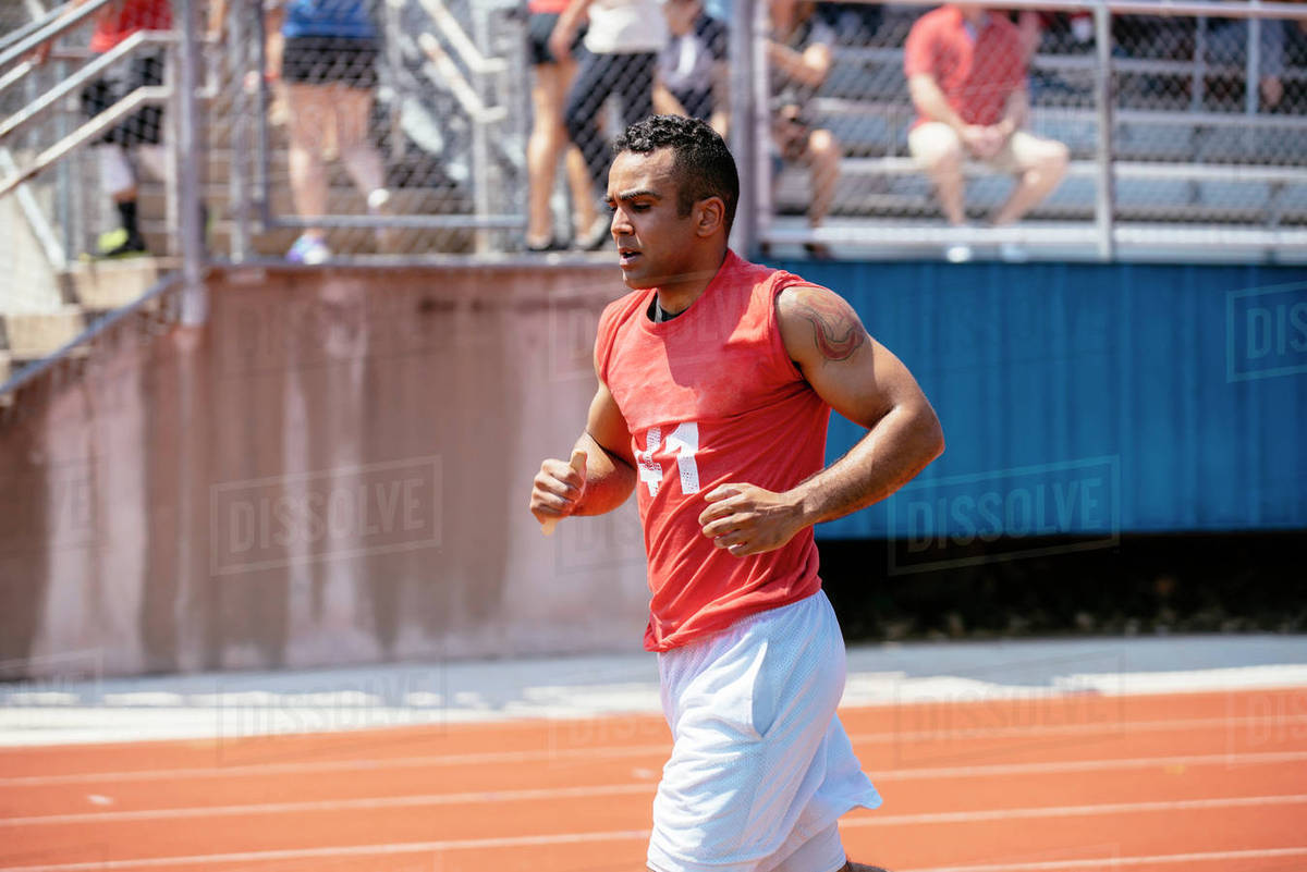 Man running on track - Royalty-free Stock Photo | Dissolve