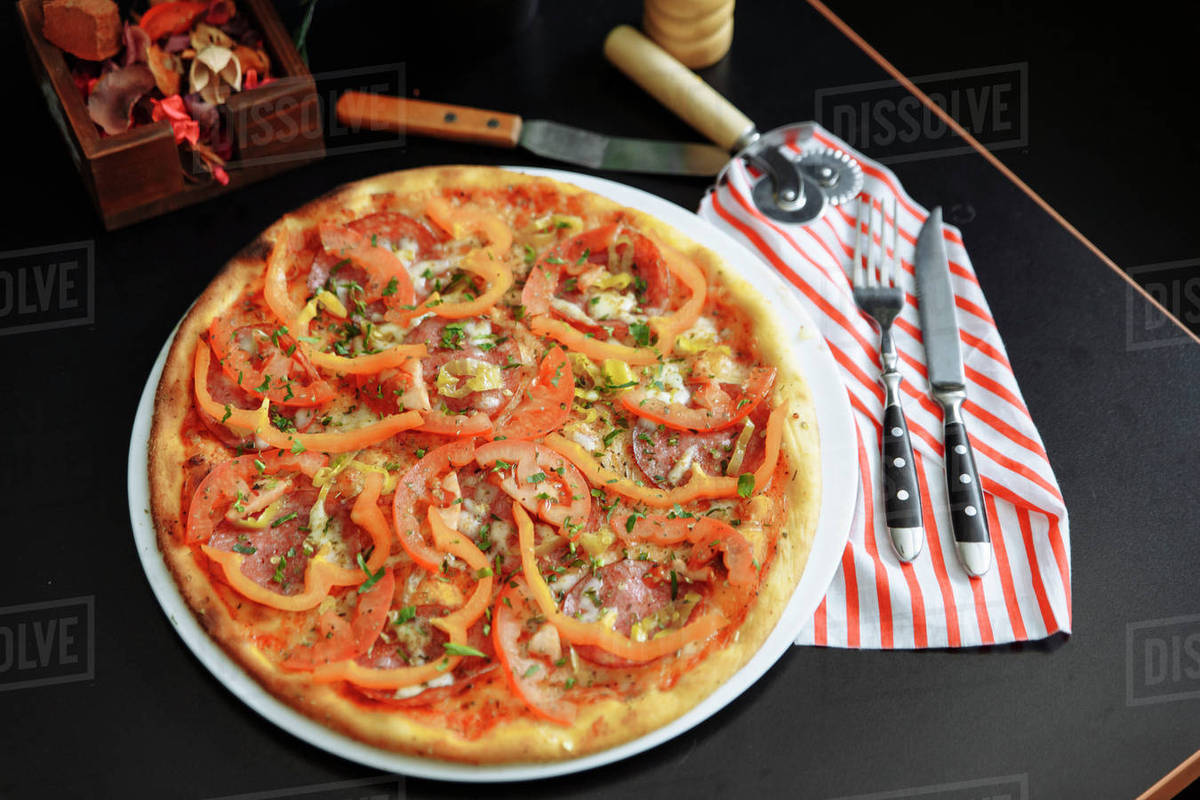 Gourmet pizza with peppers - Stock Photo - Dissolve