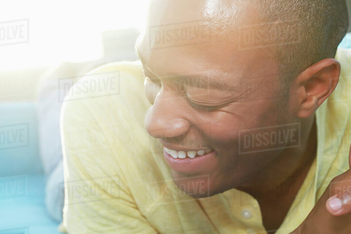 Close up of Black man smiling - Royalty-free Stock Photo | Dissolve