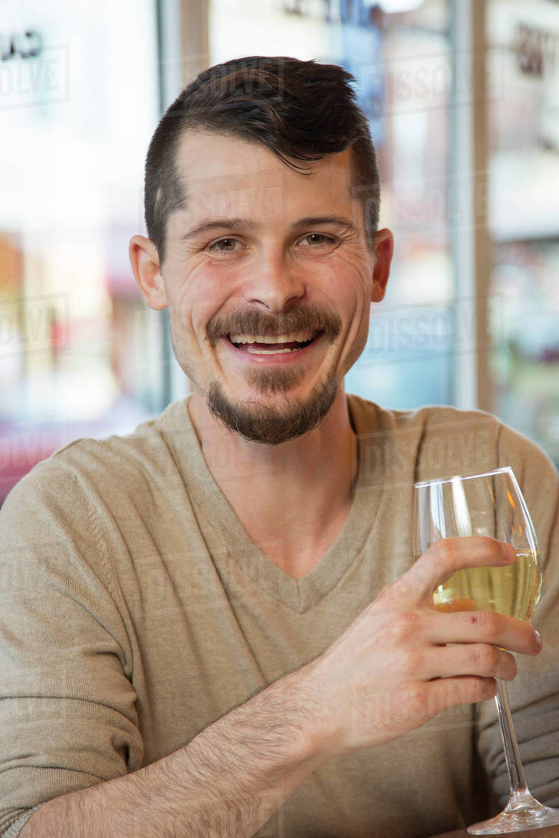 Portrait of Caucasian man drinking white wine - Royalty-free Stock ...