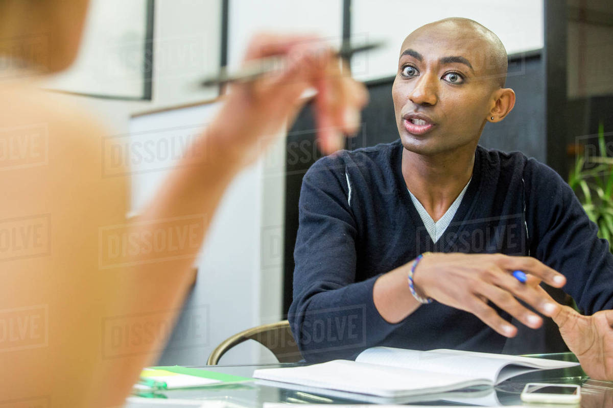 Serious people talking in meeting - Royalty-free Stock Photo | Dissolve