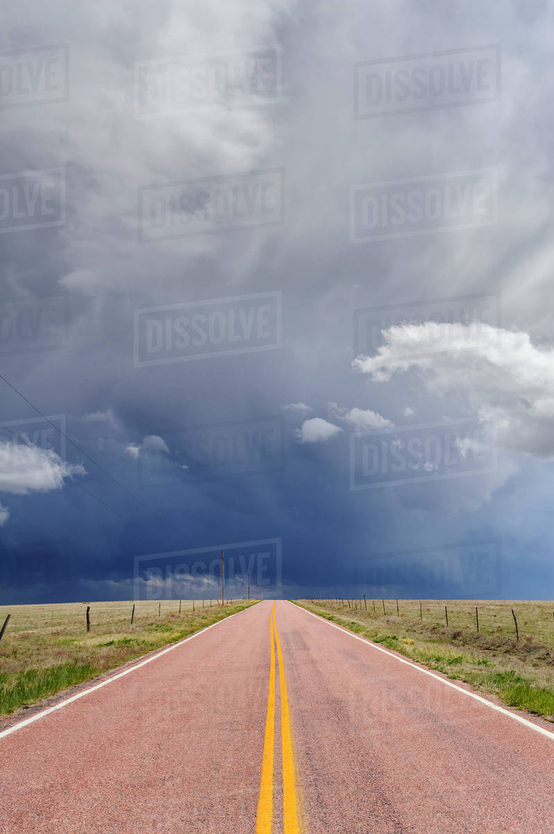 Storm clouds over open road, Rush, Colorado, United States - Royalty ...