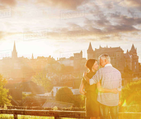 Caucasian couple enjoying scenic view - Royalty-free Stock Photo | Dissolve
