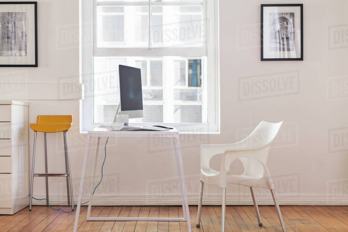 Empty chair and computer - Royalty-free Stock Photo | Dissolve