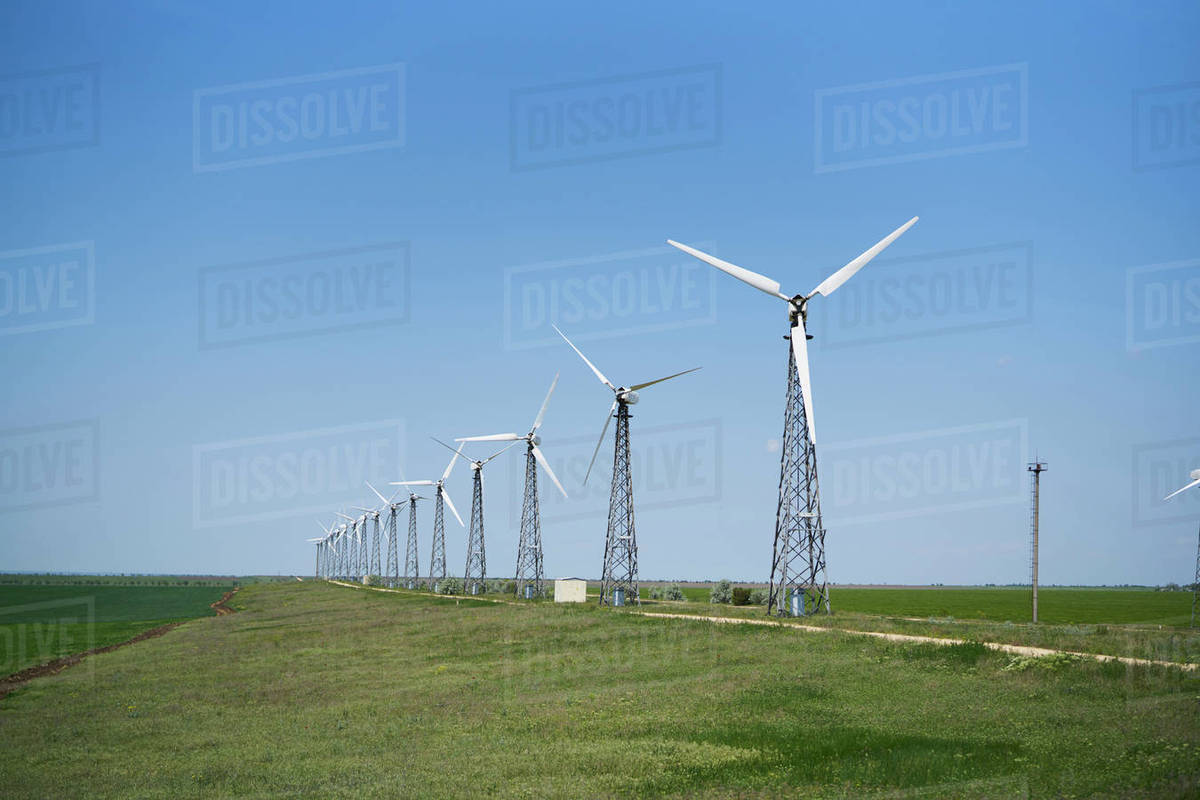 Row of wind turbines - Royalty-free Stock Photo | Dissolve