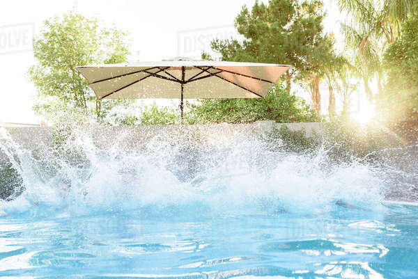 Water splashing in swimming pool - Stock Photo - Dissolve