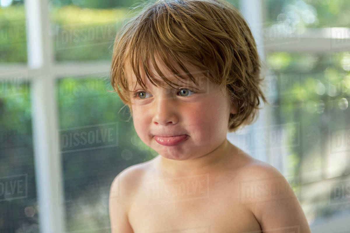 Caucasian boy pouting - Royalty-free Stock Photo | Dissolve