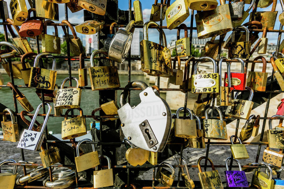 Padlocks on fence at river - Royalty-free Stock Photo | Dissolve