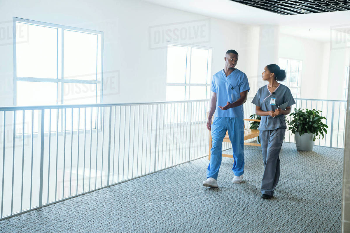 Nurses walking and talking - Royalty-free Stock Photo | Dissolve