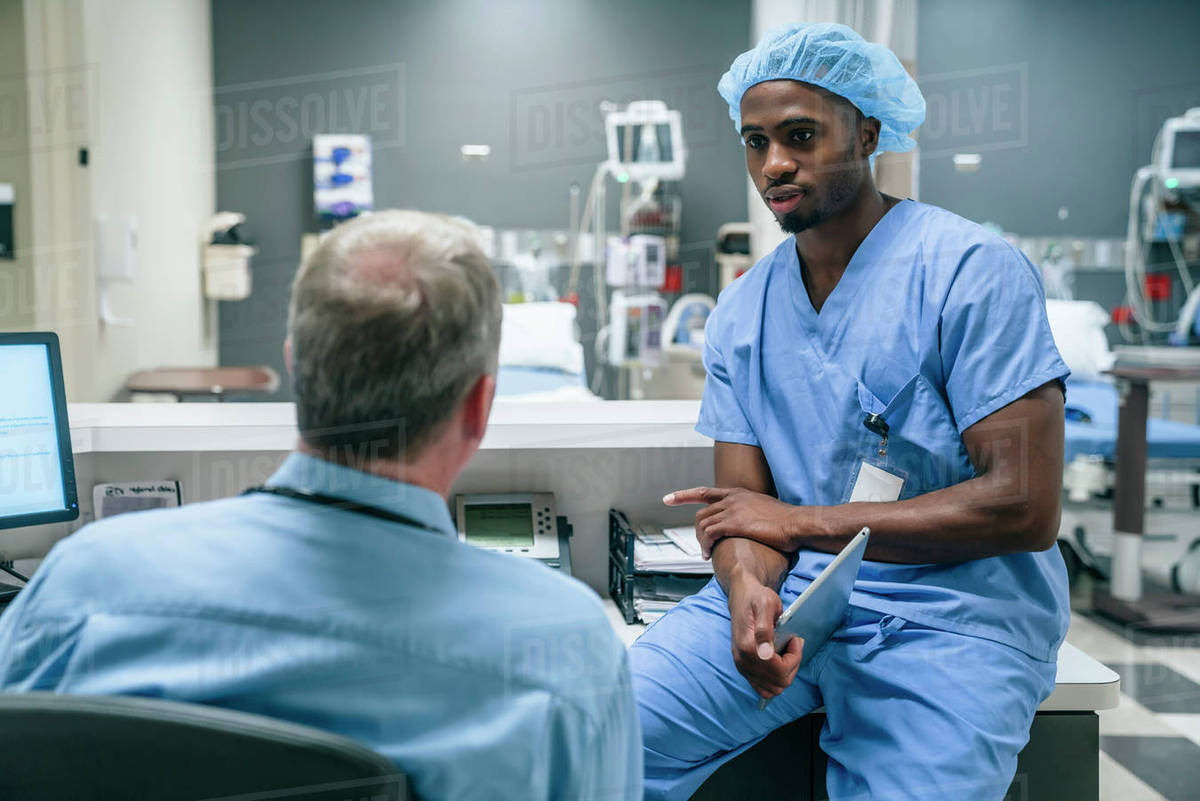 Doctor and nurse talking - Royalty-free Stock Photo | Dissolve