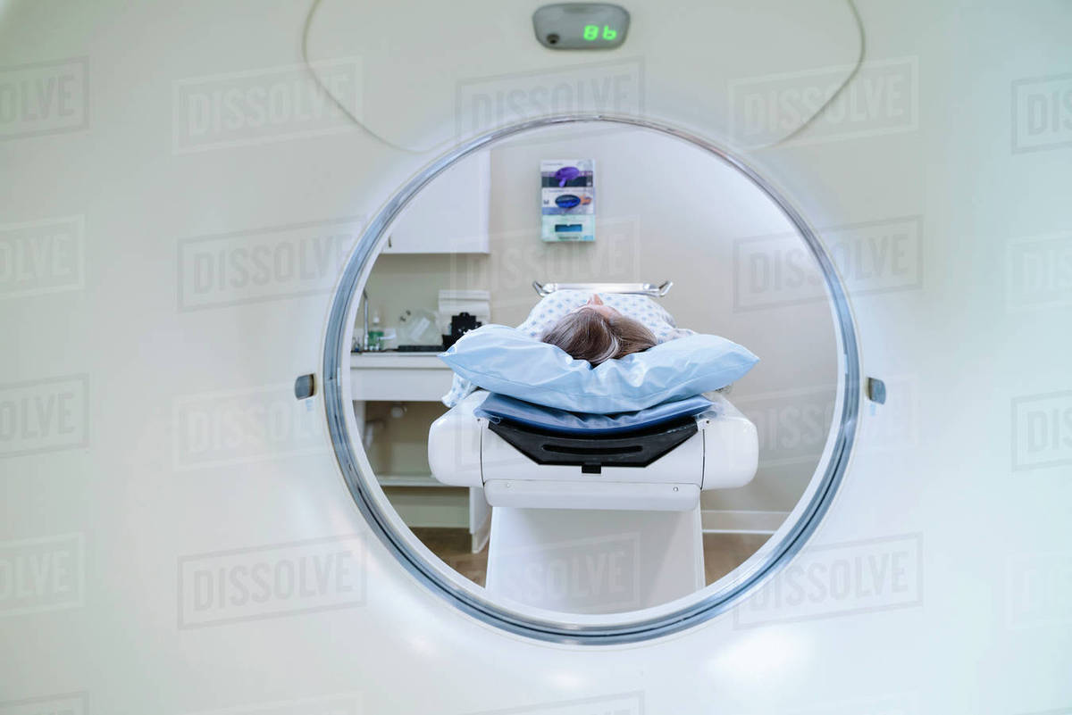 Caucasian patient laying on scanner table - Royalty-free Stock Photo ...