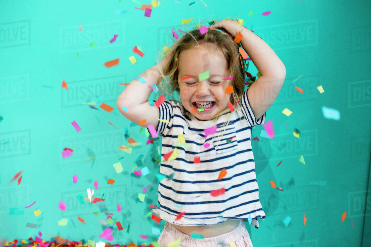 Colorful confetti falling on Caucasian girl - Royalty-free Stock Photo ...