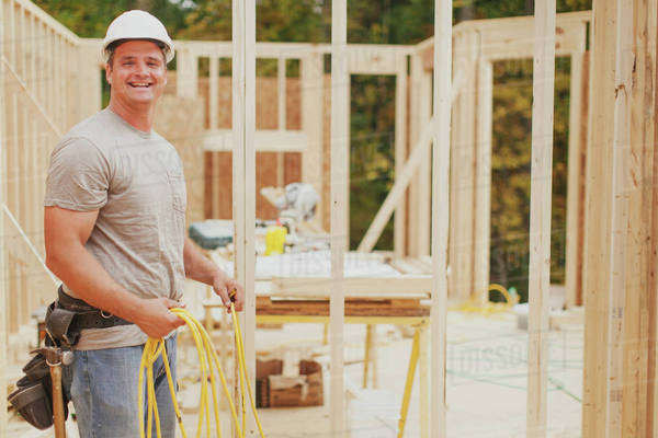 Caucasian construction worker smiling on site - Royalty-free Stock ...