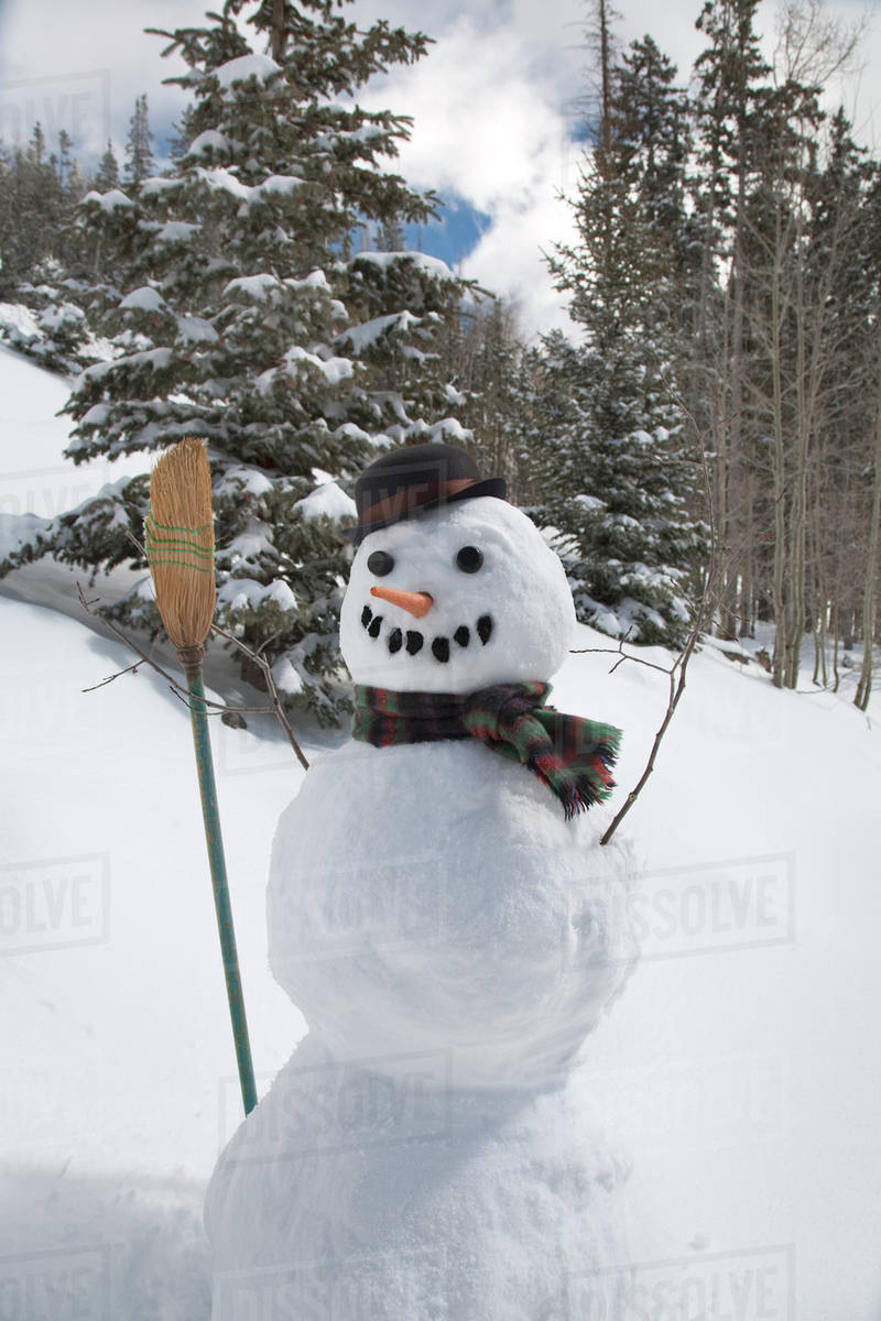 Snowman in rural forest - Royalty-free Stock Photo | Dissolve