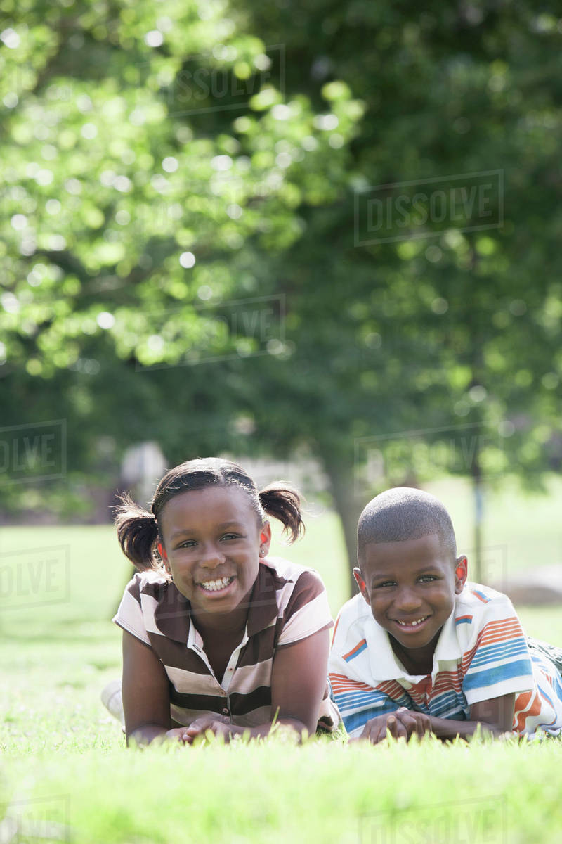 African American children laying in park - Royalty-free Stock Photo ...