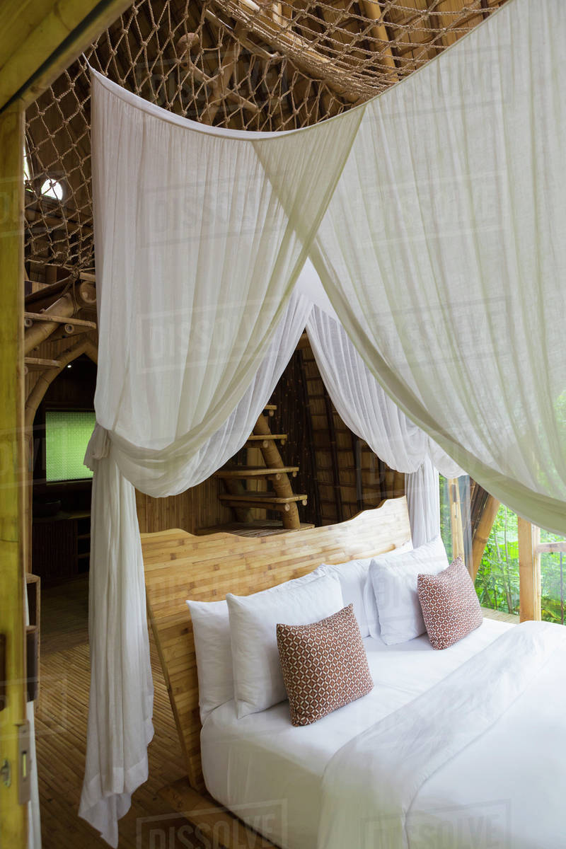 Canopy over bed in hotel room - Royalty-free Stock Photo | Dissolve