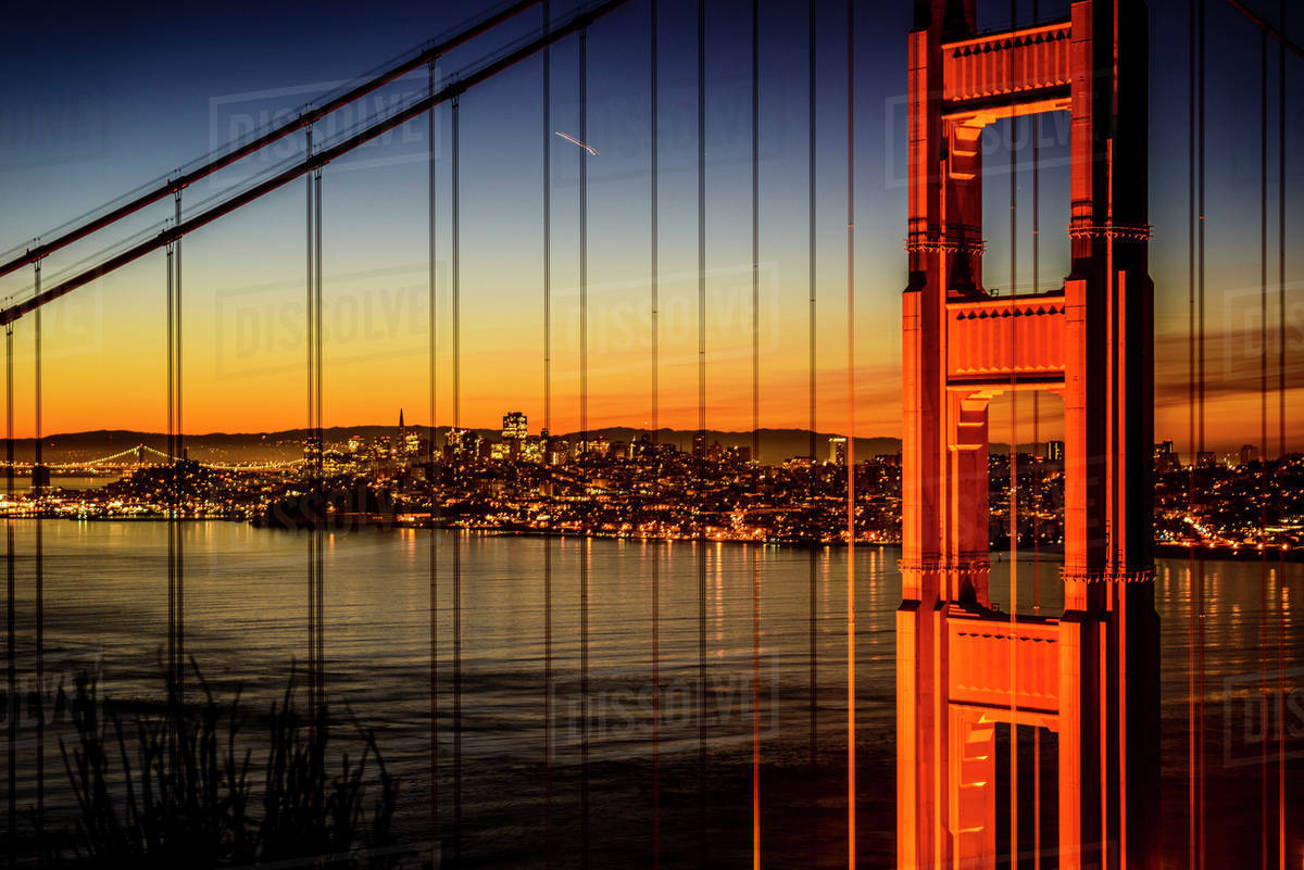 Golden Gate Bridge and San Francisco skyline lit up at night, San ...