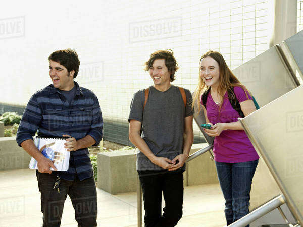College students laughing on campus - Stock Photo - Dissolve