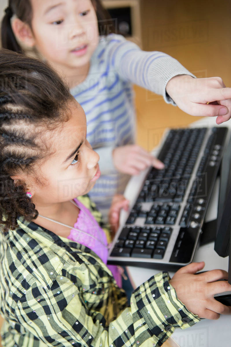Children using computer together - Royalty-free Stock Photo | Dissolve