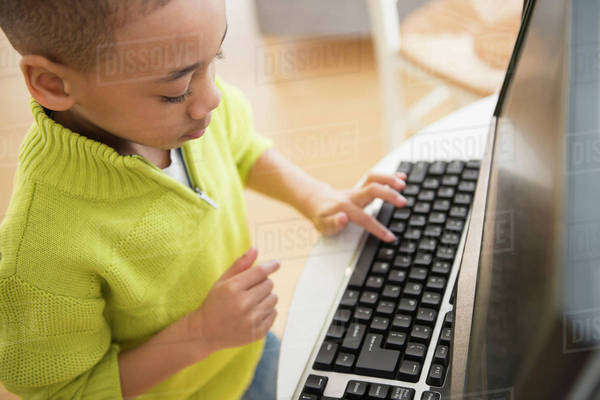 African American boy using computer - Royalty-free Stock Photo | Dissolve
