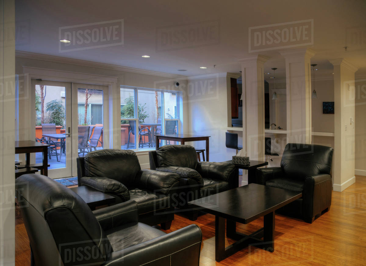 Armchairs and coffee tables in common area - Royalty-free Stock Photo ...