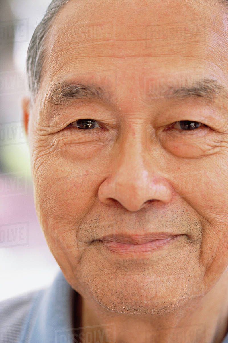 Close up of Senior man's smiling face - Royalty-free Stock Photo | Dissolve