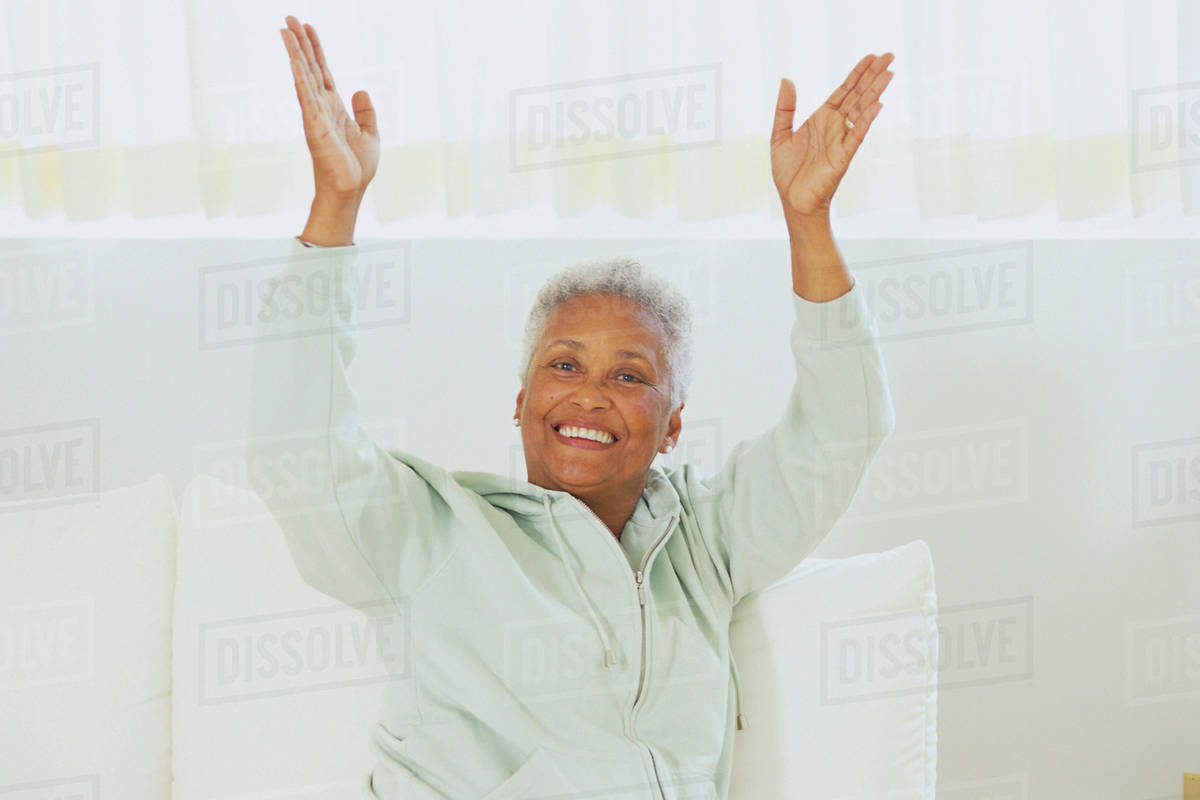 Senior woman clapping her hands - Stock Photo - Dissolve