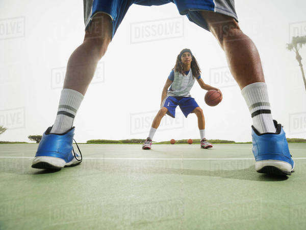 Basketball teams playing on court - Royalty-free Stock Photo | Dissolve