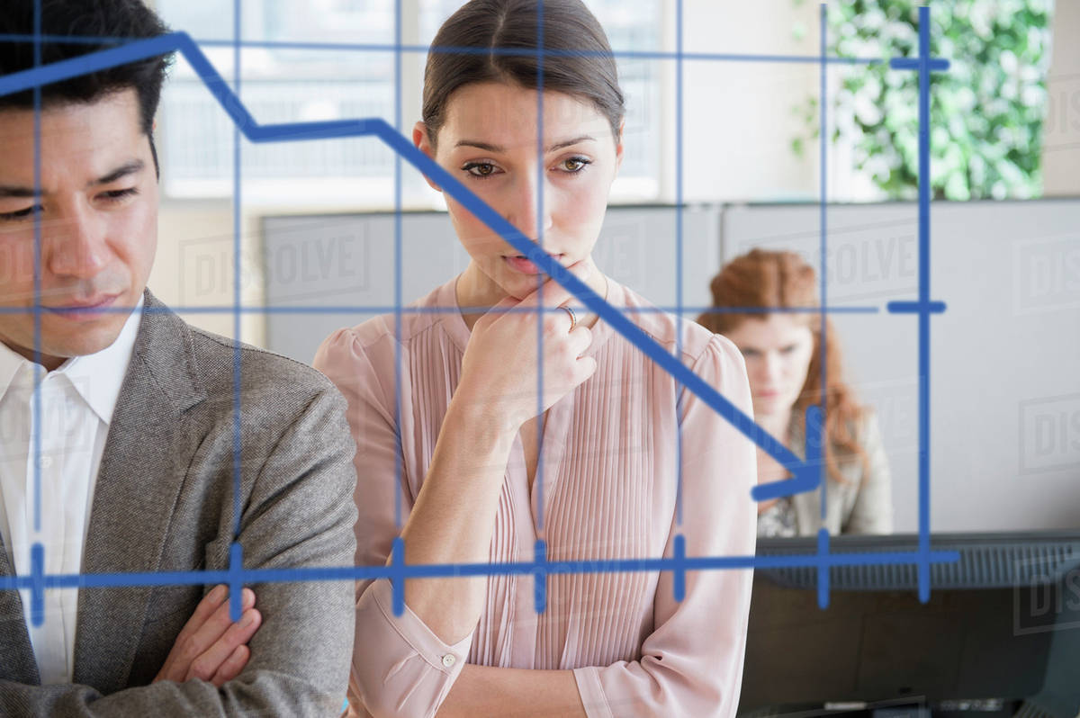 Business people examining graph on window - Stock Photo - Dissolve
