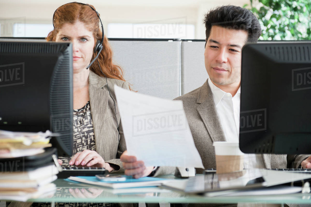 Business people working at desk - Royalty-free Stock Photo | Dissolve