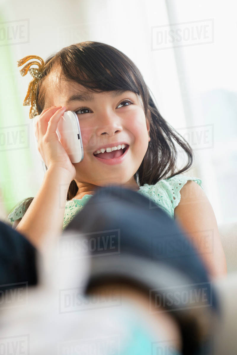Filipino girl talking on cell phone - Royalty-free Stock Photo | Dissolve