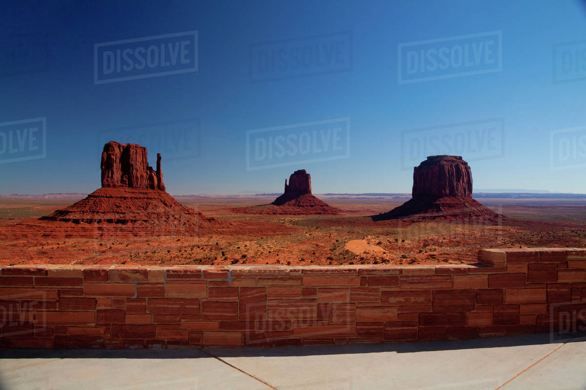 Butte rock formations in desert landscape, Monument Valley Tribal Park ...