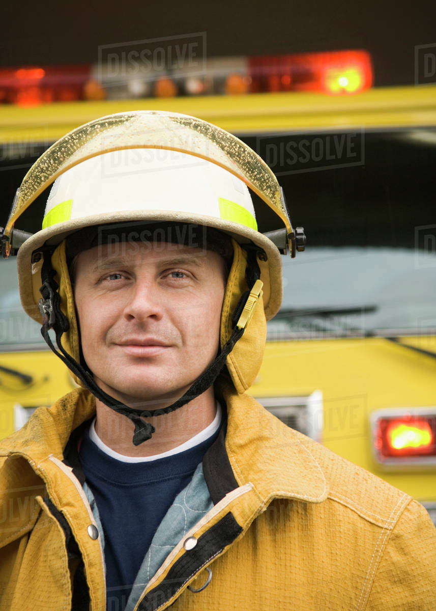 Caucasian firefighter wearing uniform and helmet - Royalty-free Stock ...