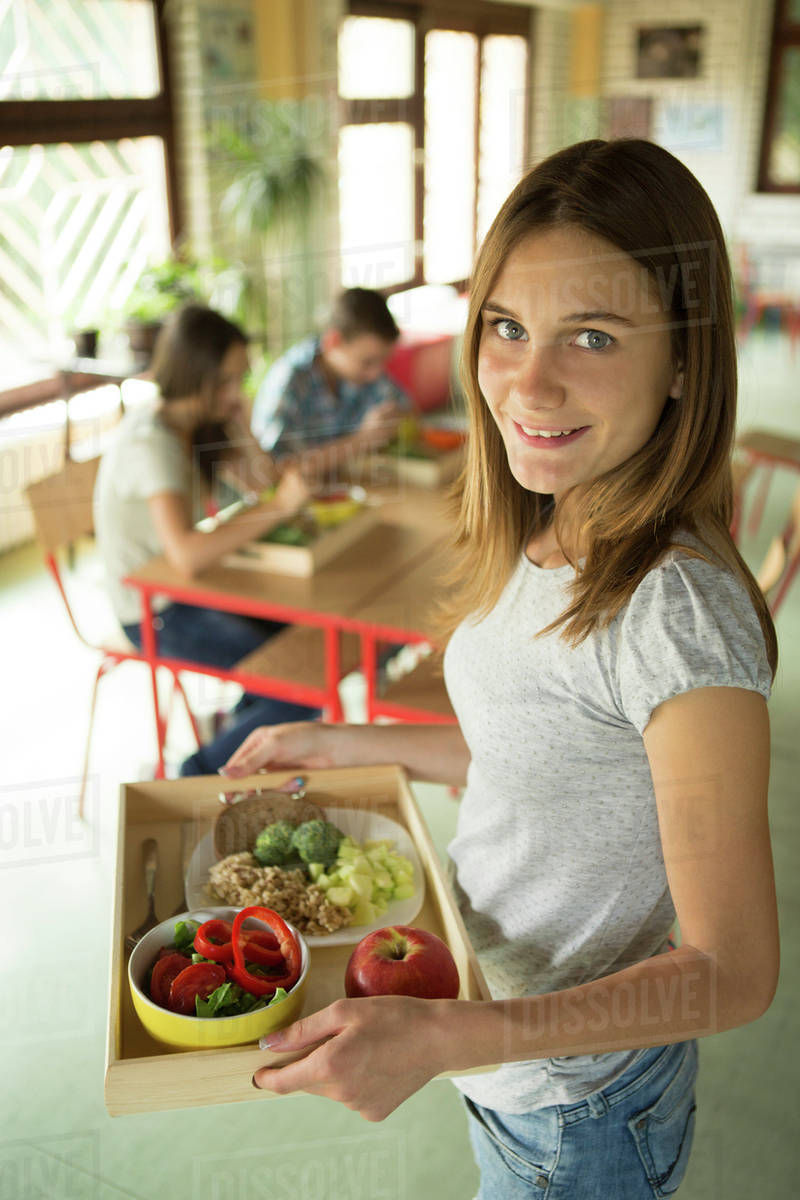 Student carrying lunch tray in school cafeteria - Royalty-free Stock ...