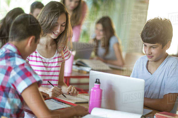 Students studying in school cafeteria - Royalty-free Stock Photo | Dissolve