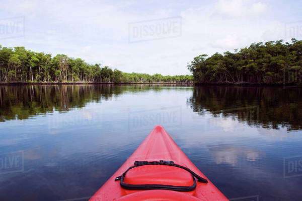 Kayak floating in lake - Stock Photo - Dissolve