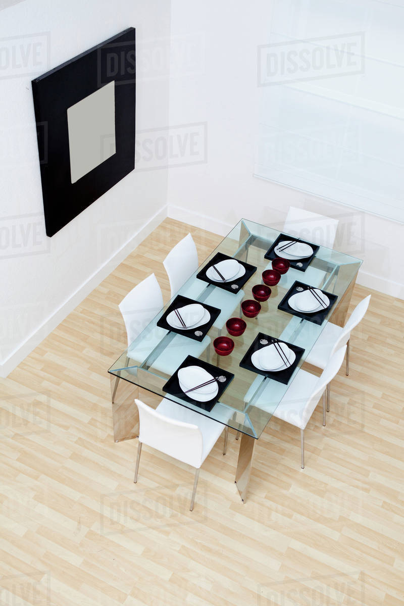 High angle view of set table and chairs in modern dining room - Stock ...