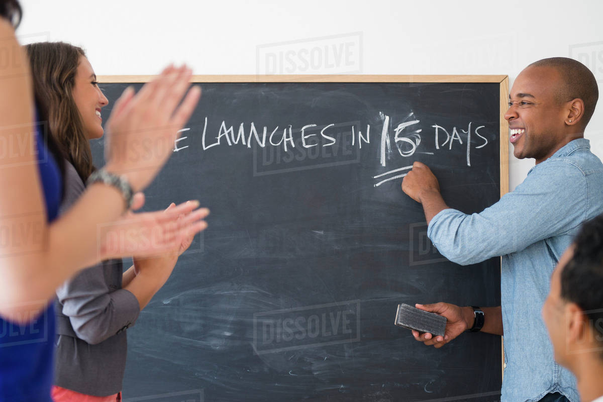 Business people cheering and preparing for launch in office - Royalty ...