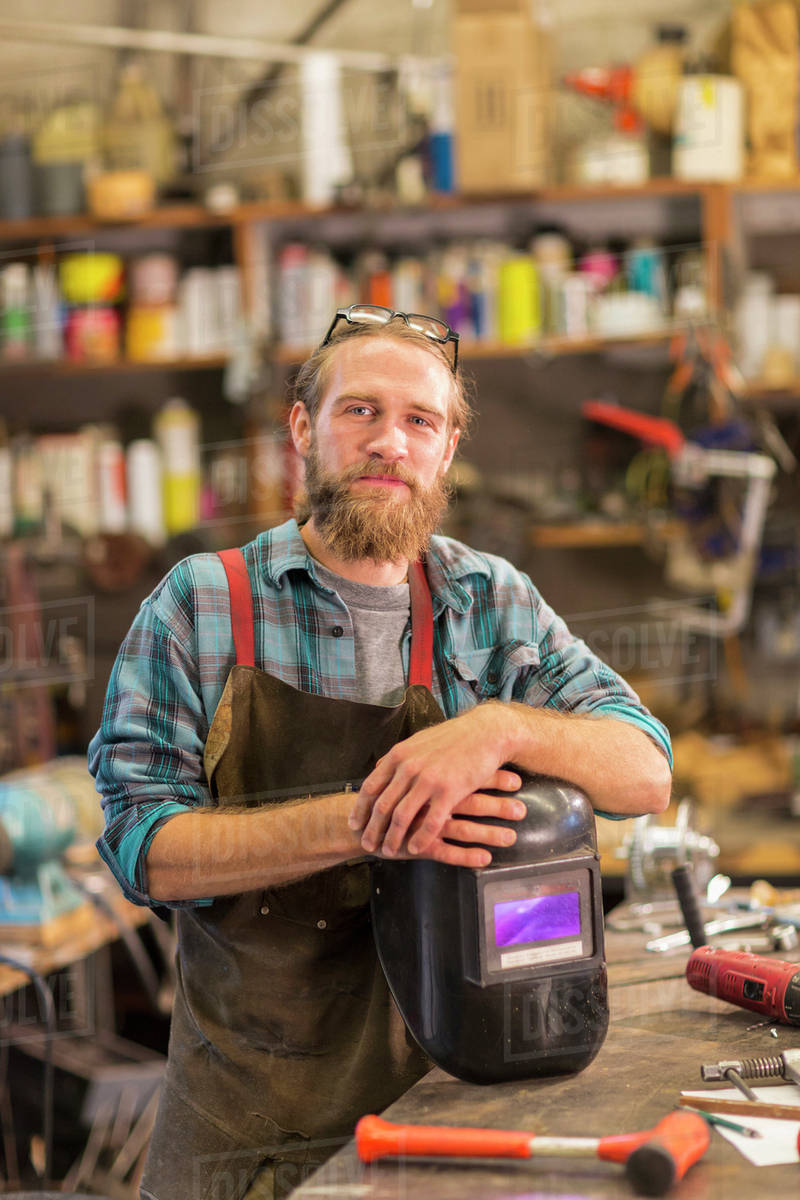 Caucasian craftsman smiling in workshop - Royalty-free Stock Photo ...