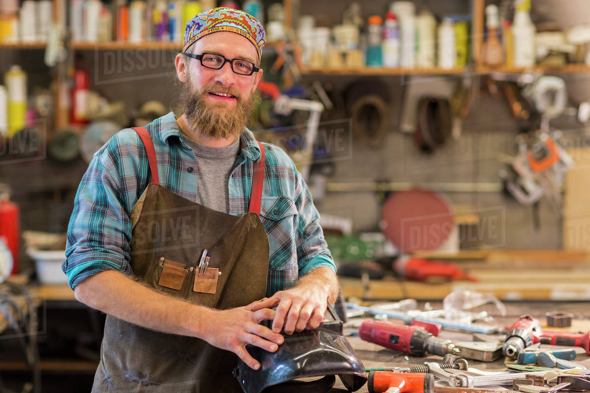 Caucasian craftsman smiling in workshop - Royalty-free Stock Photo ...