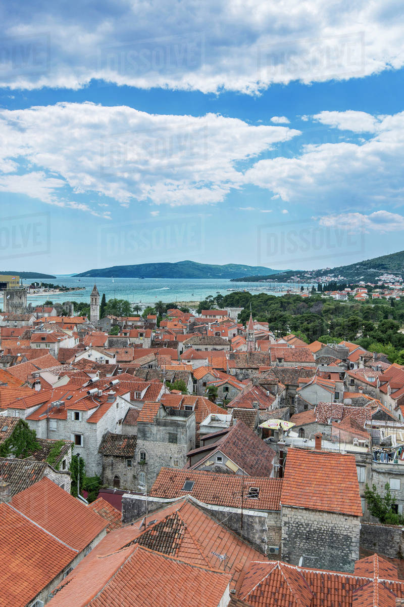 Aerial view of coastal city rooftops under cloudy sky, Trogir, Split ...