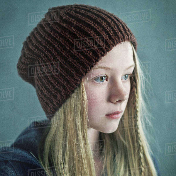 Teenage girl wearing knitted cap - Stock Photo - Dissolve