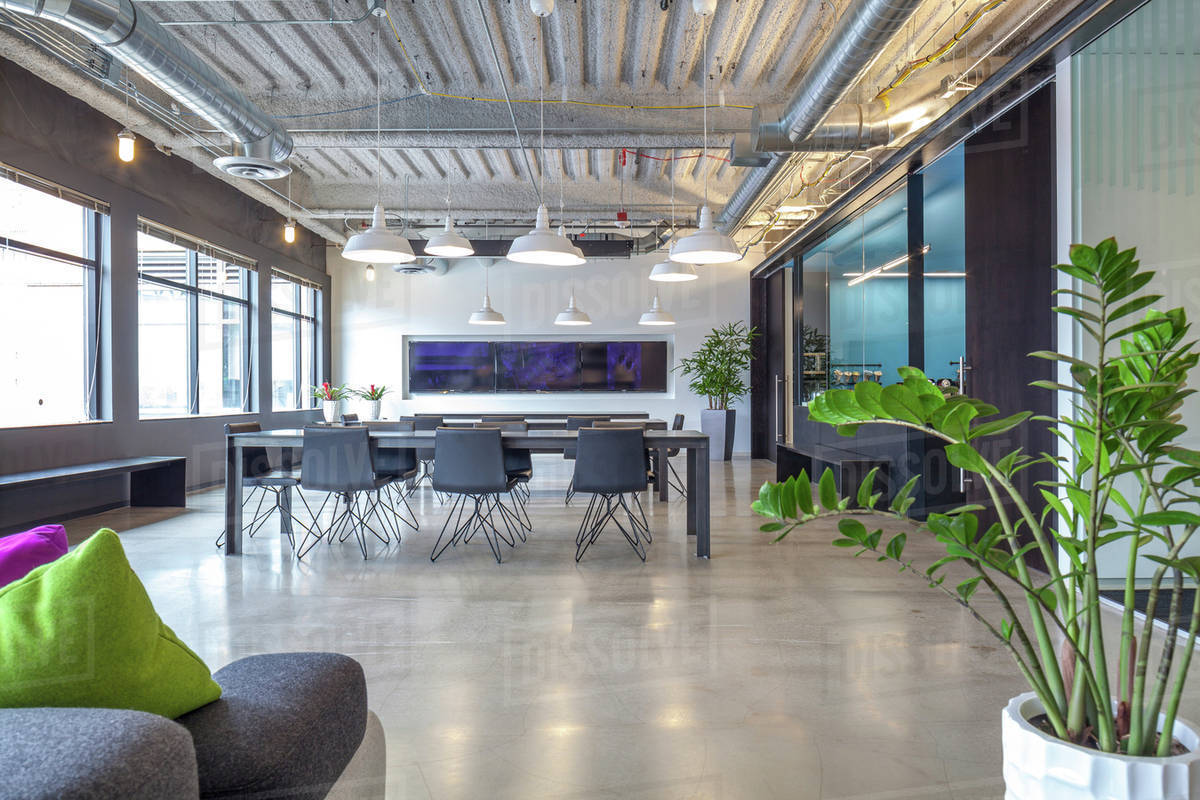 Tables in open office dining area - Stock Photo - Dissolve