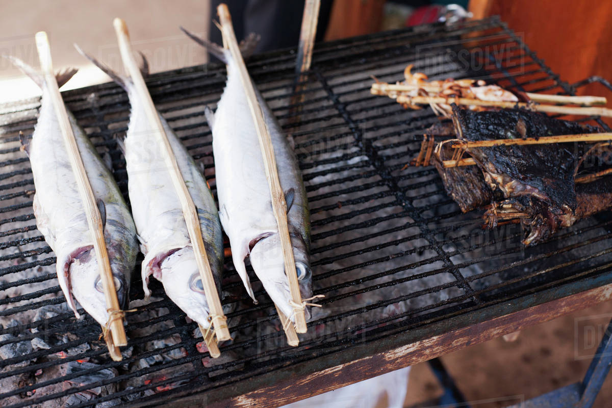 Skewered and grilled fish at the morning market - Royalty-free Stock ...